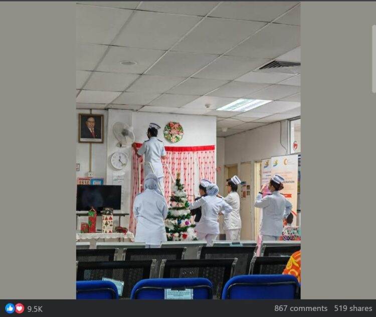Image of multi-racial nurses putting up Christmas décor is common sight ...